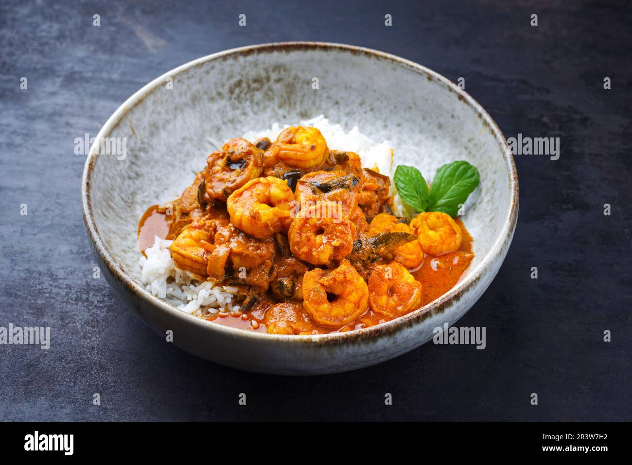 Traditional spicy Indian prawn Madras curry Rogan Josh with king prawns ...