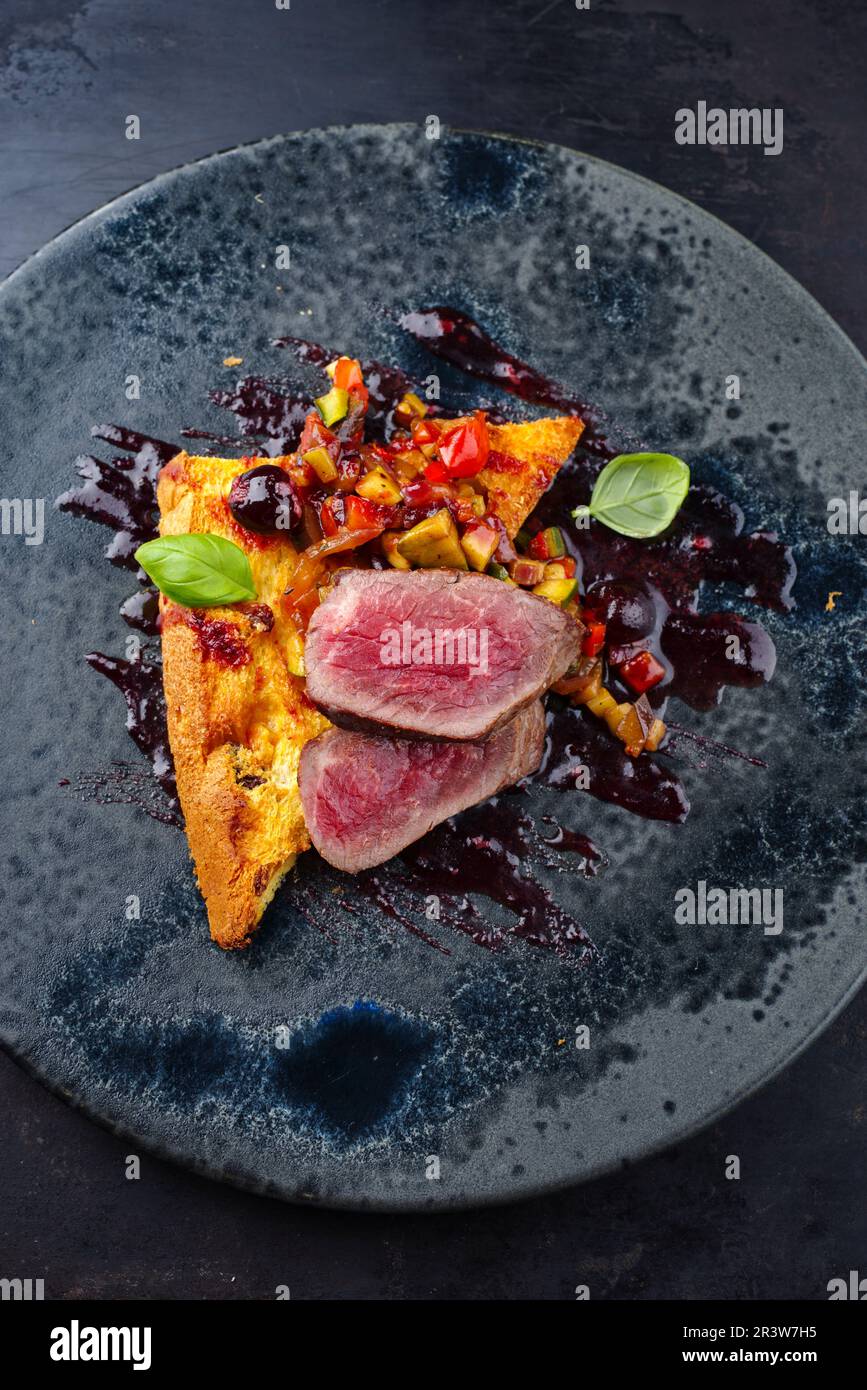 Traditional roasted Italian panettone tagliata di manzo with sliced ...