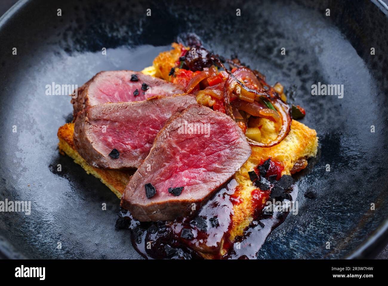 Traditional roasted Italian panettone tagliata di manzo with sliced ...