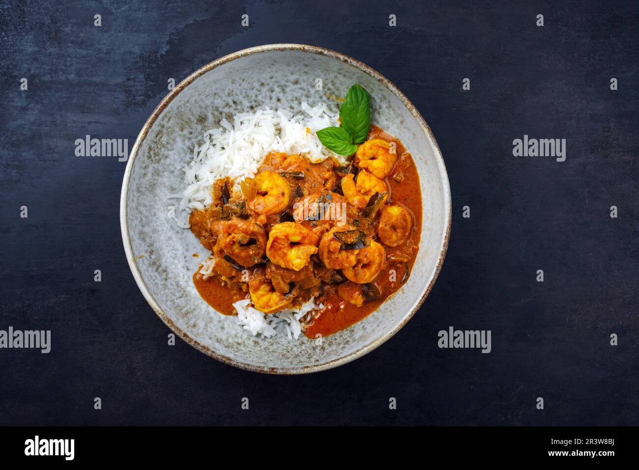 Traditional spicy Indian prawn Madras curry Rogan Josh with king prawns ...
