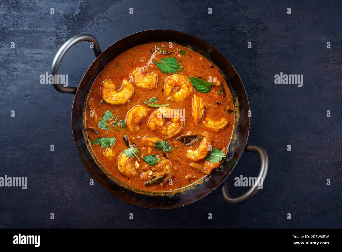 Traditional spicy Indian prawn Madras curry Rogan Josh with king prawns ...