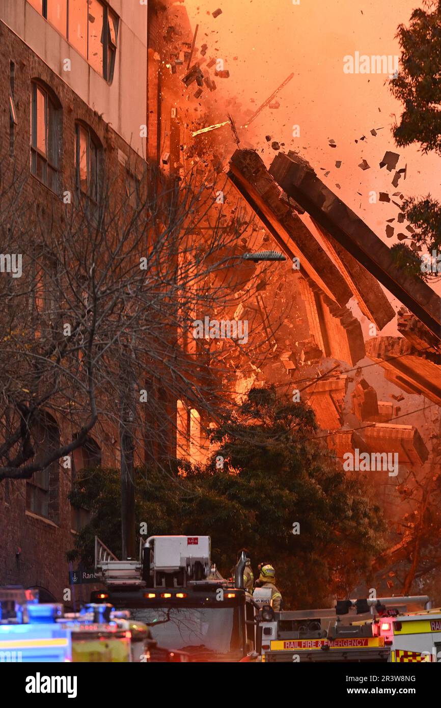 A wall collapses during a building fire in the Central Business ...
