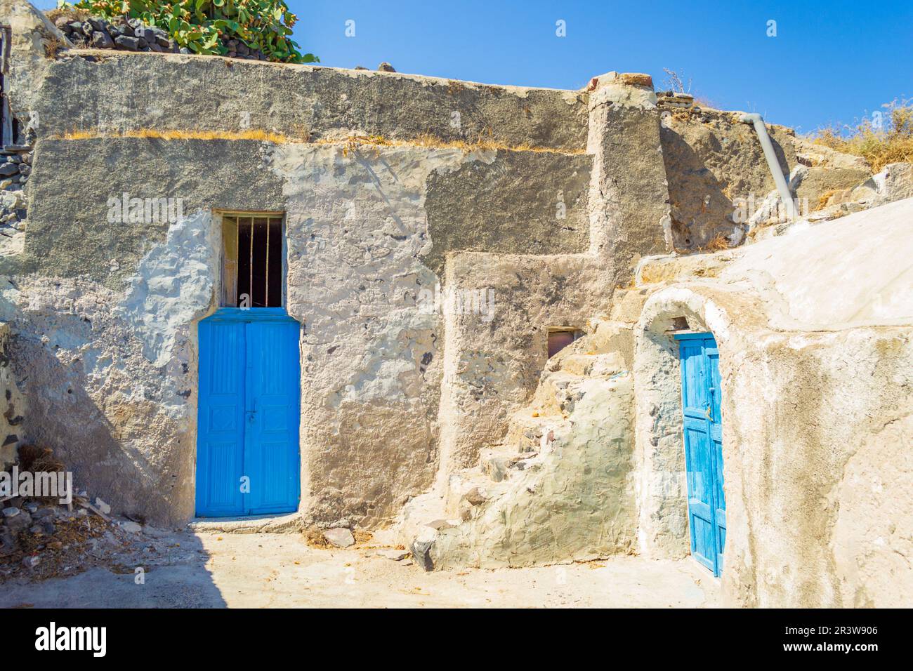 Traditional old cave houses from Thirasia island opposite Santorini ...