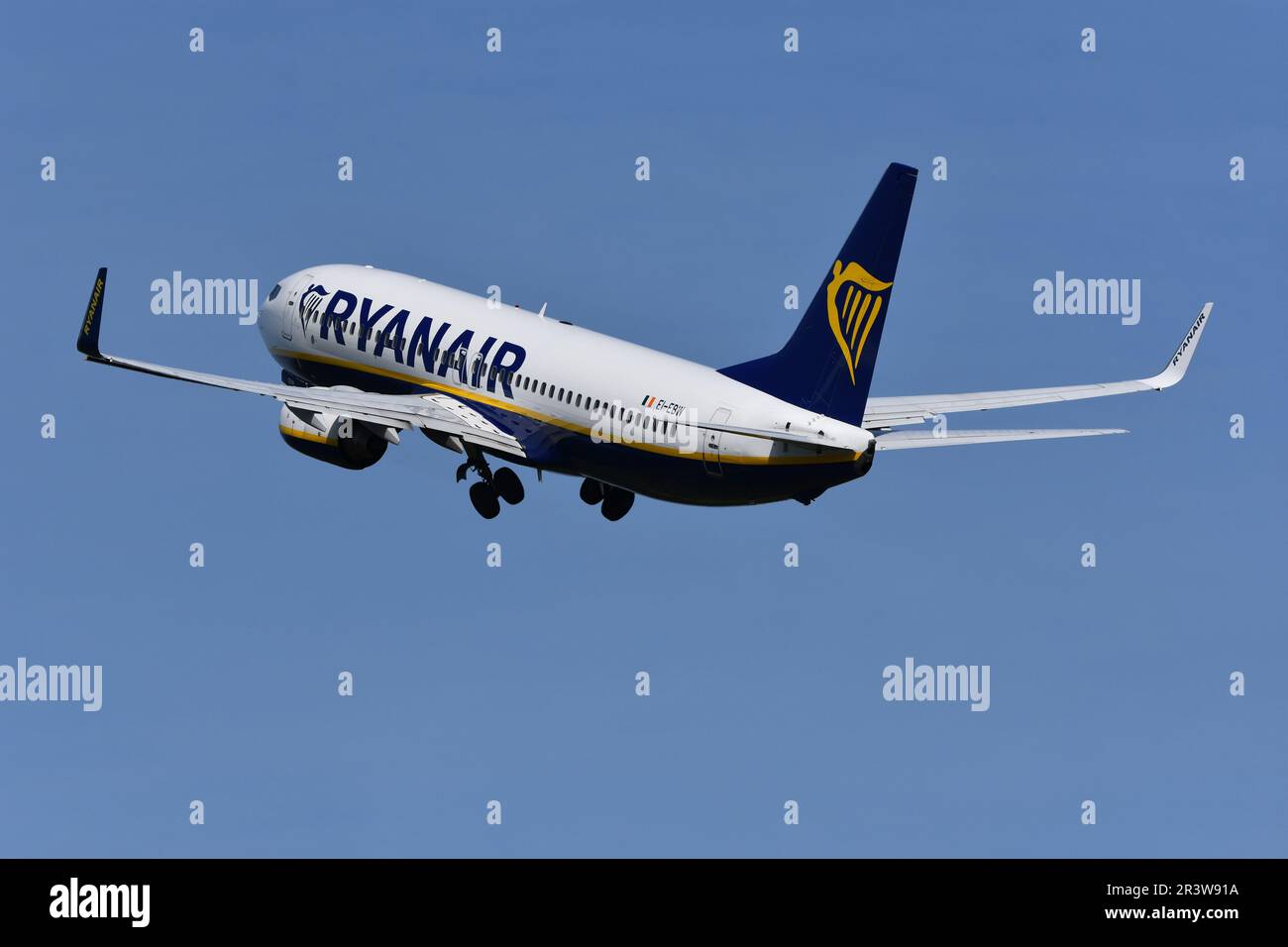 A Ryanair aeroplane that has just taken off with the wheels going in ...