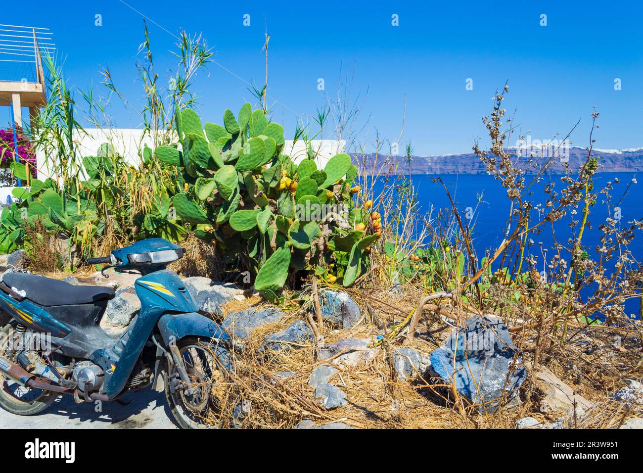 Traditional old moped at a street in Thirasia island opposite Santorini ...