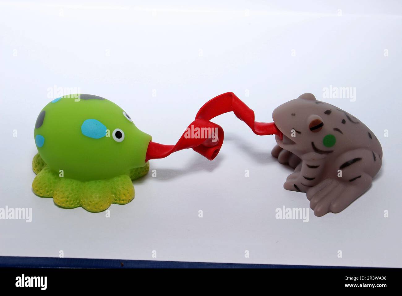 Octopus and frog made of rubber on a white background Stock Photo - Alamy