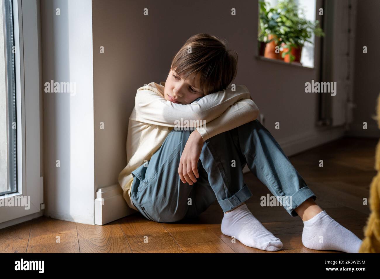 Sad boy teenager on floor hi-res stock photography and images - Alamy