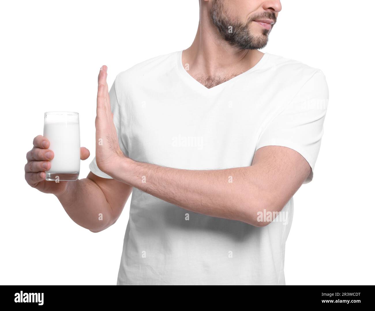 Man with glass of milk suffering from lactose intolerance on white ...