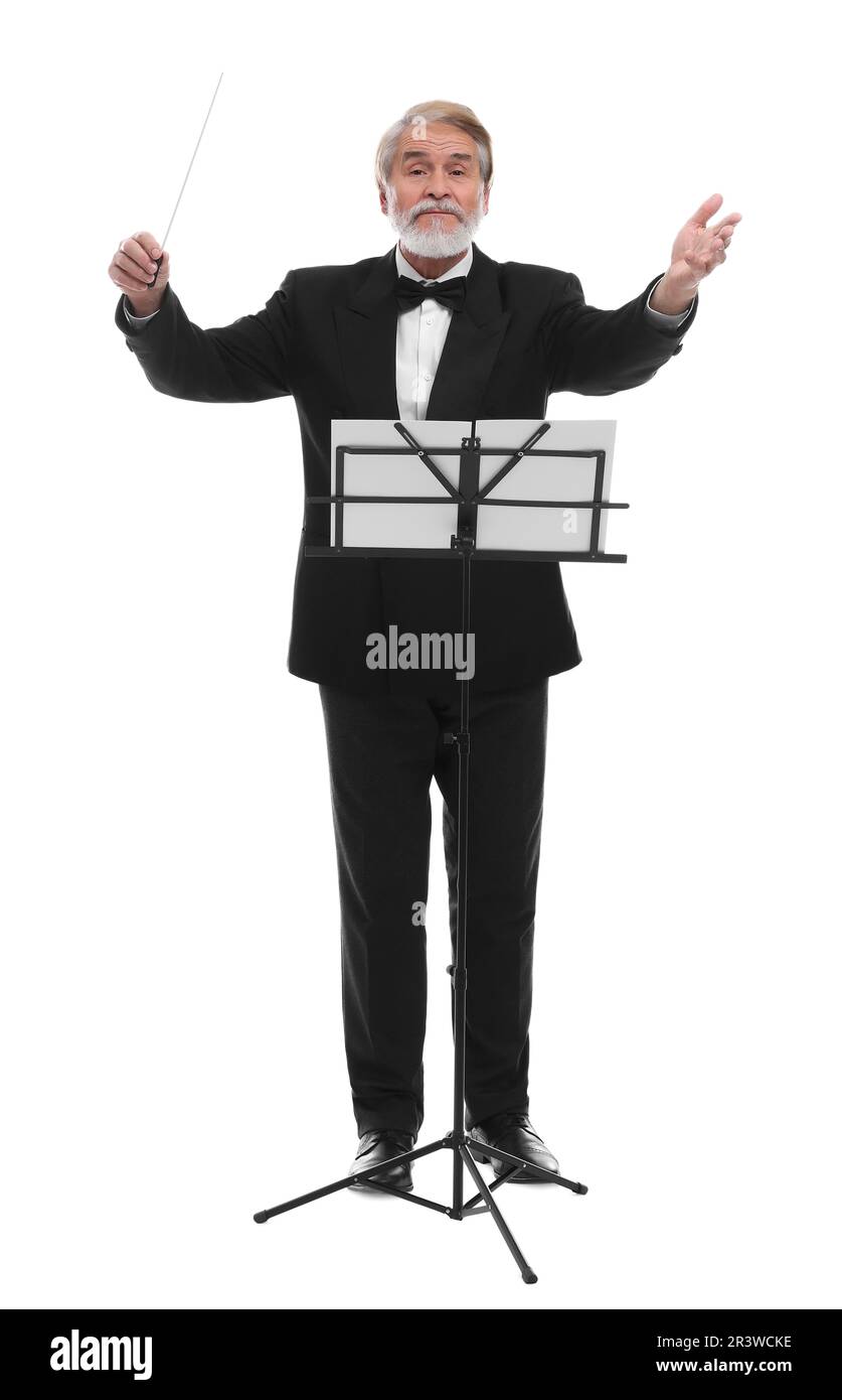 Professional conductor with baton and note stand on white background ...