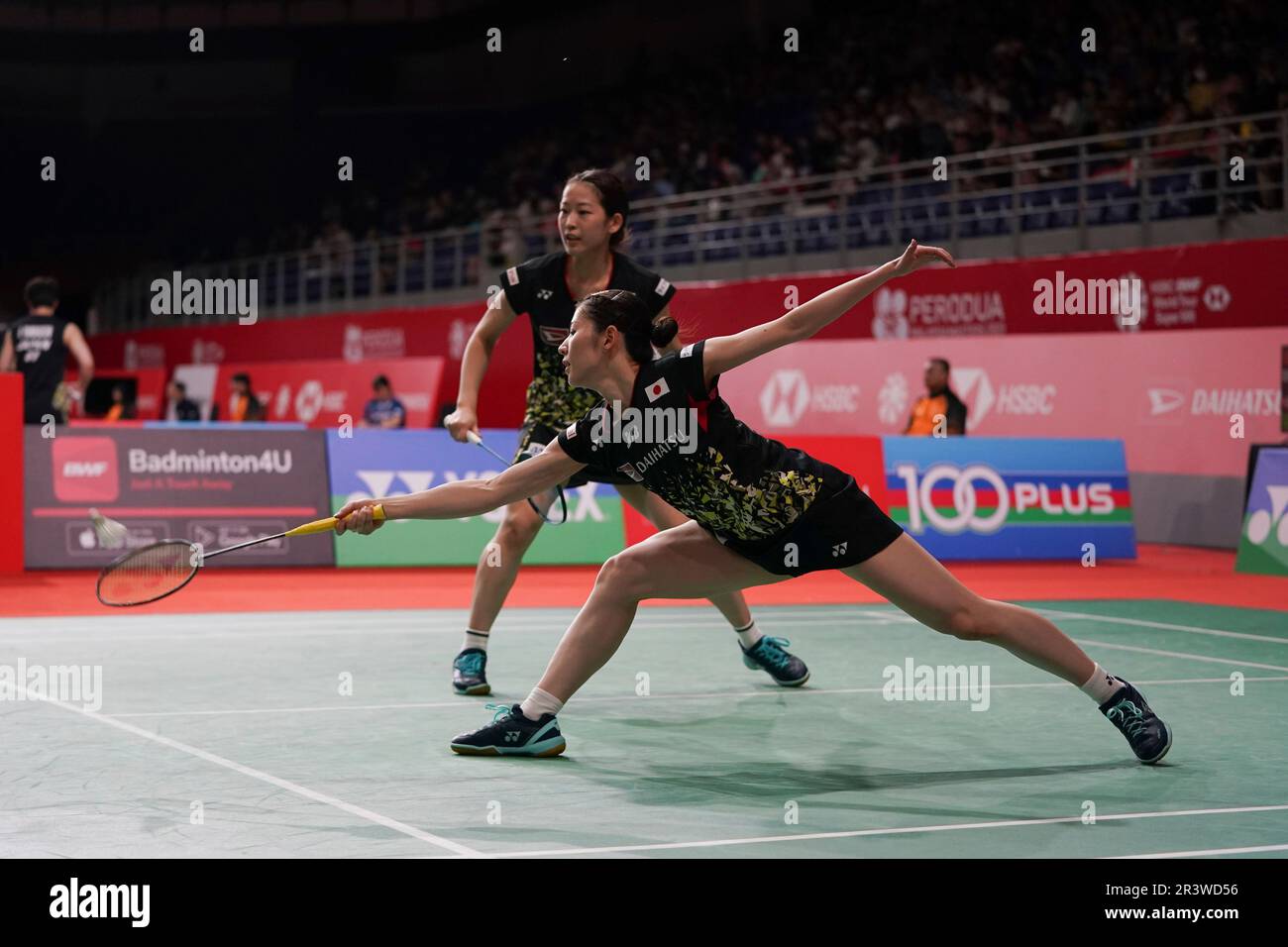 Japan's Chiharu Shida, front, and Nami Matsuyama play during their women's doubles badminton ...