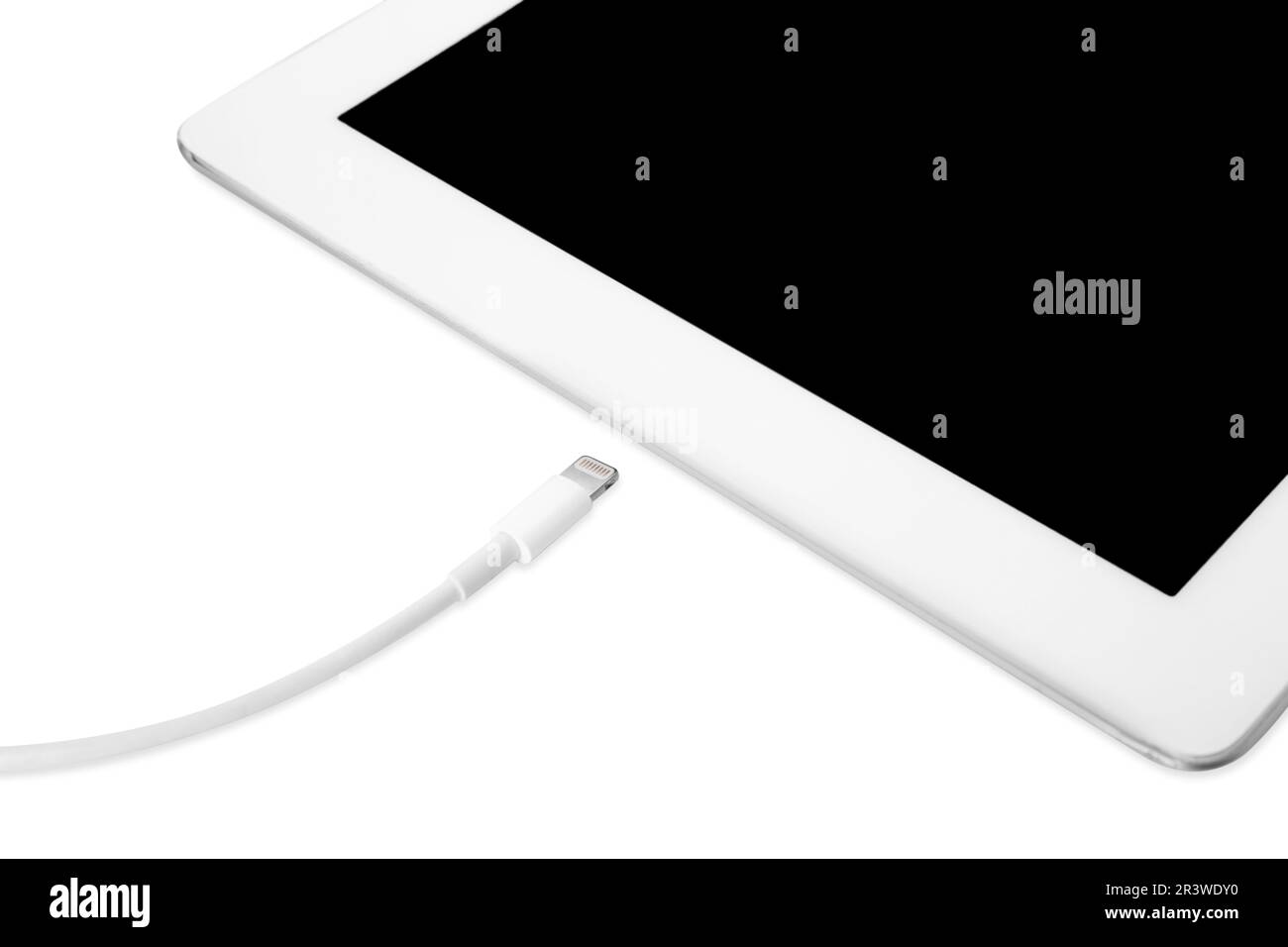 USB cable with lightning connector and tablet on white background Stock ...
