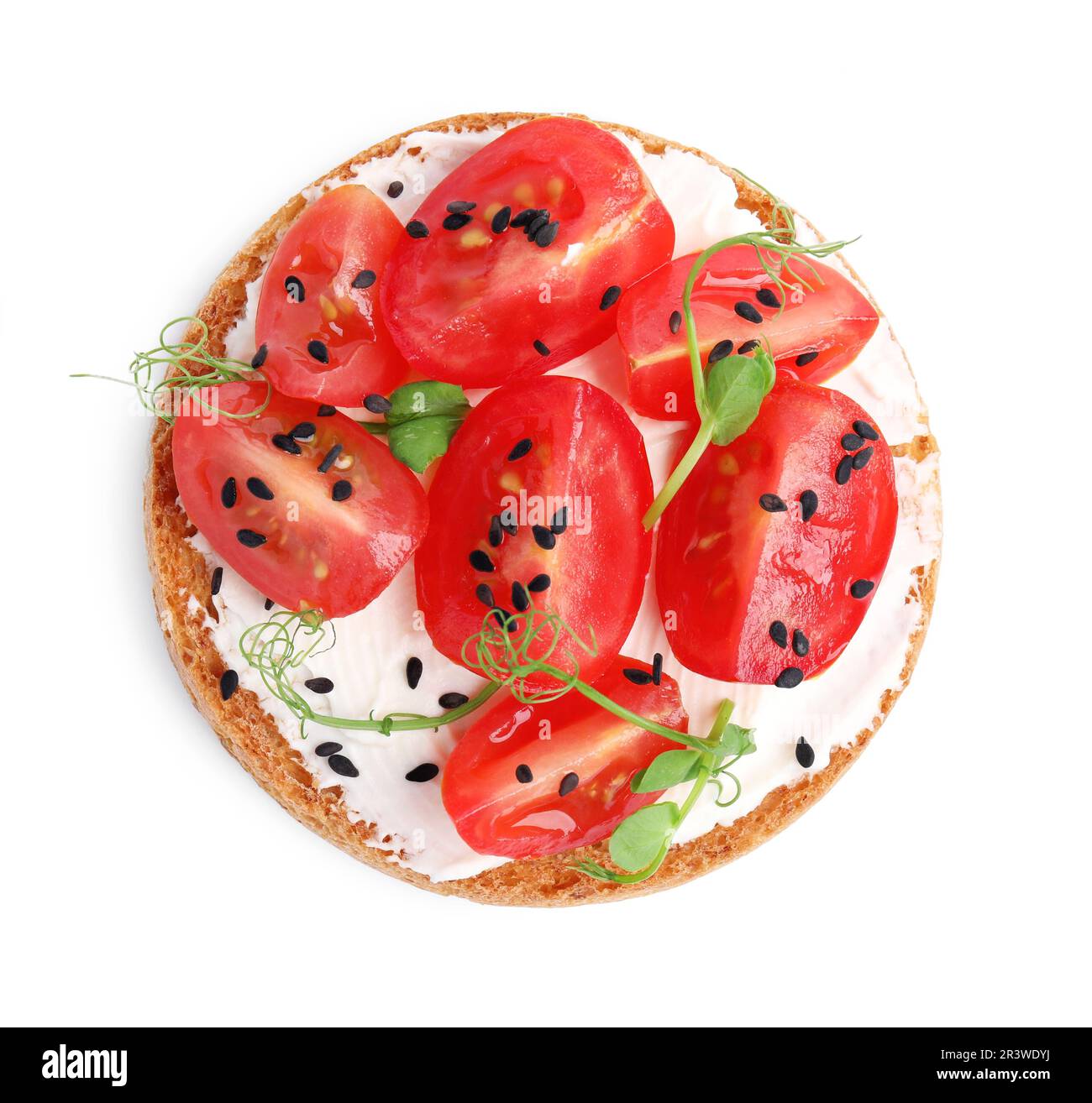 Tasty rusk with cream cheese, fresh tomatoes and black sesame seeds ...