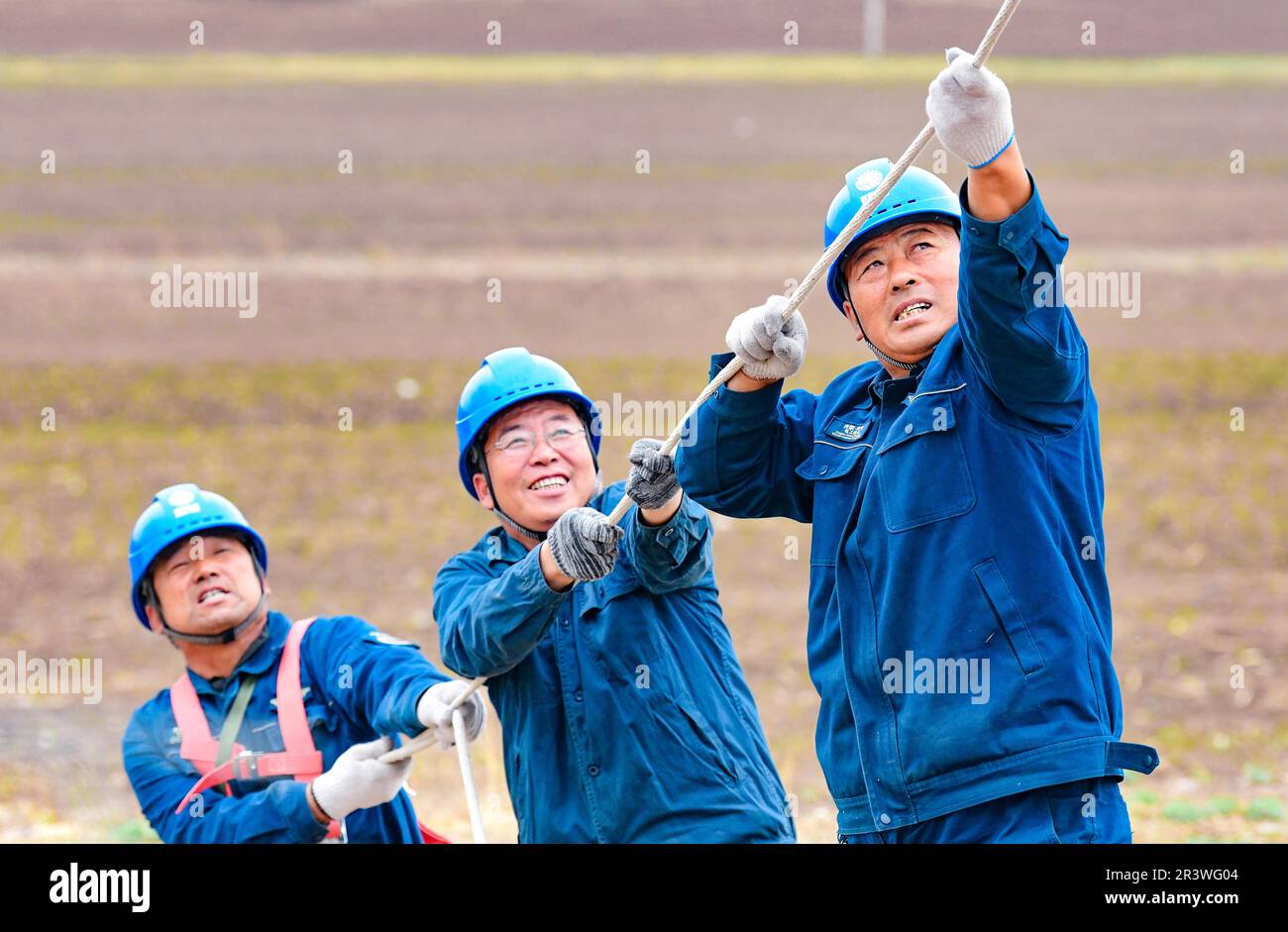 HINGGAN LEAGUE, CHINA - MAY 25, 2023 - Workers of a power supply ...
