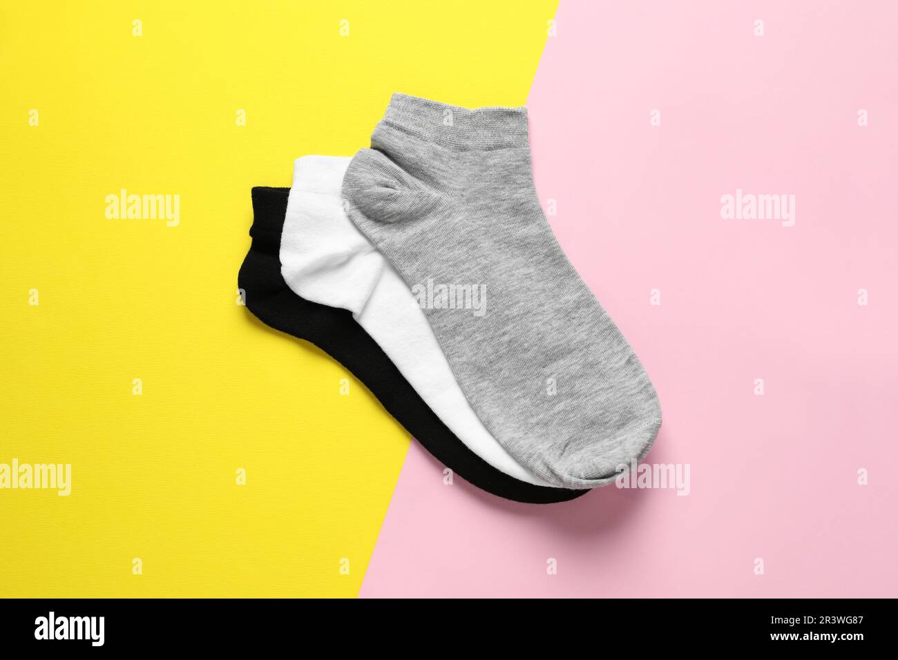 Different socks on colorful background, flat lay Stock Photo - Alamy