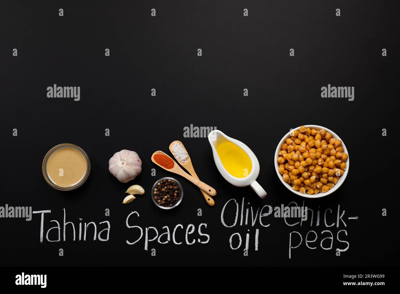 Delicious hummus, ingredients and chalk written products names on black ...