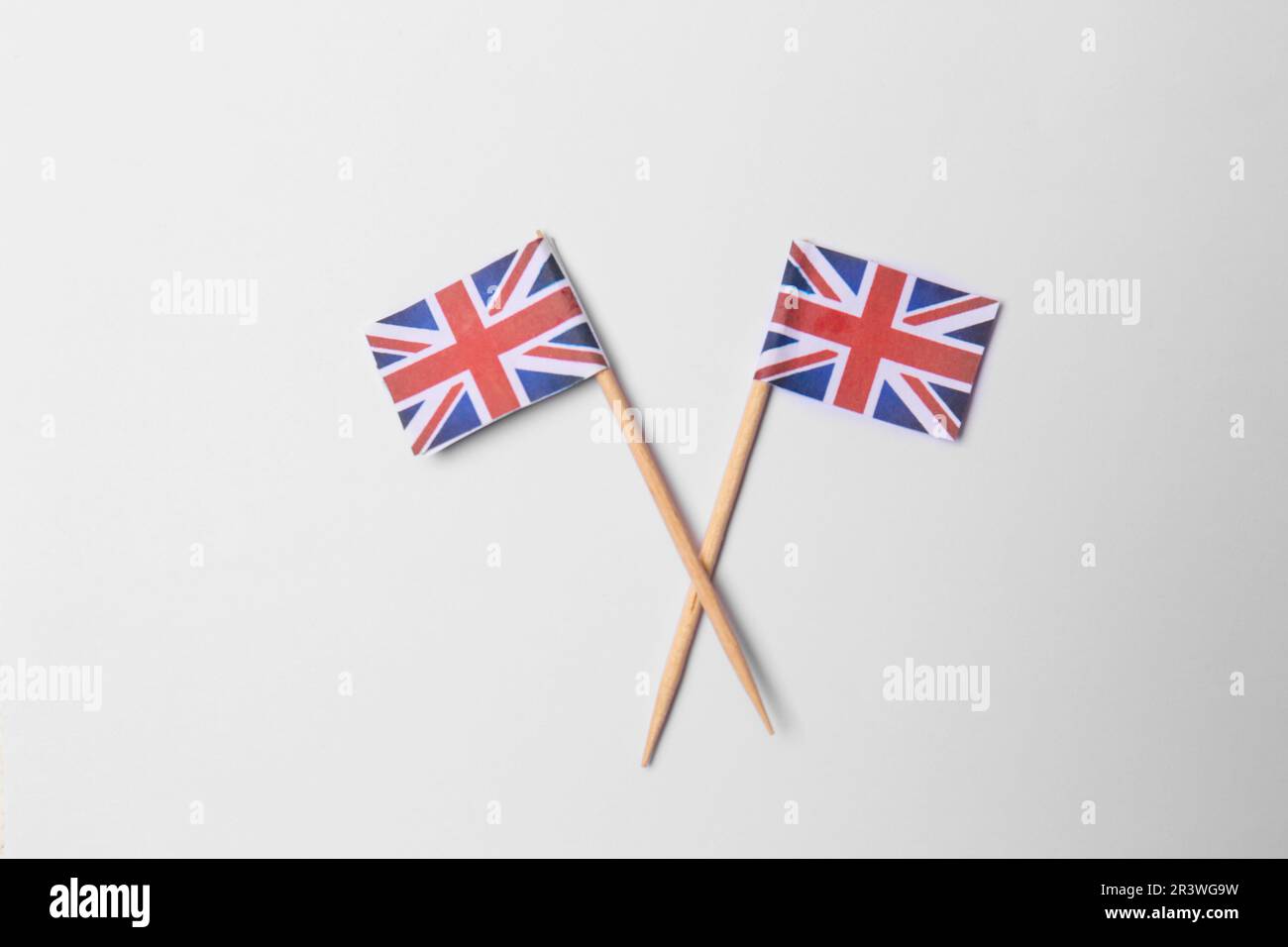 Small paper flags of United Kingdom on light background, flat lay Stock ...