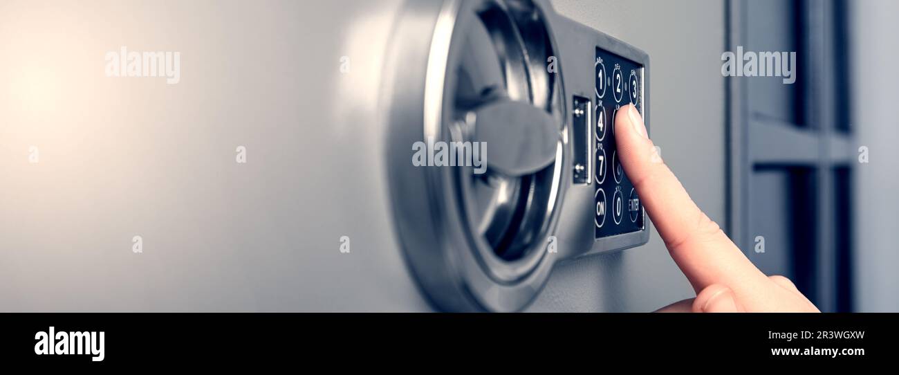 Woman opening steel safe with electronic lock, closeup. Banner design ...