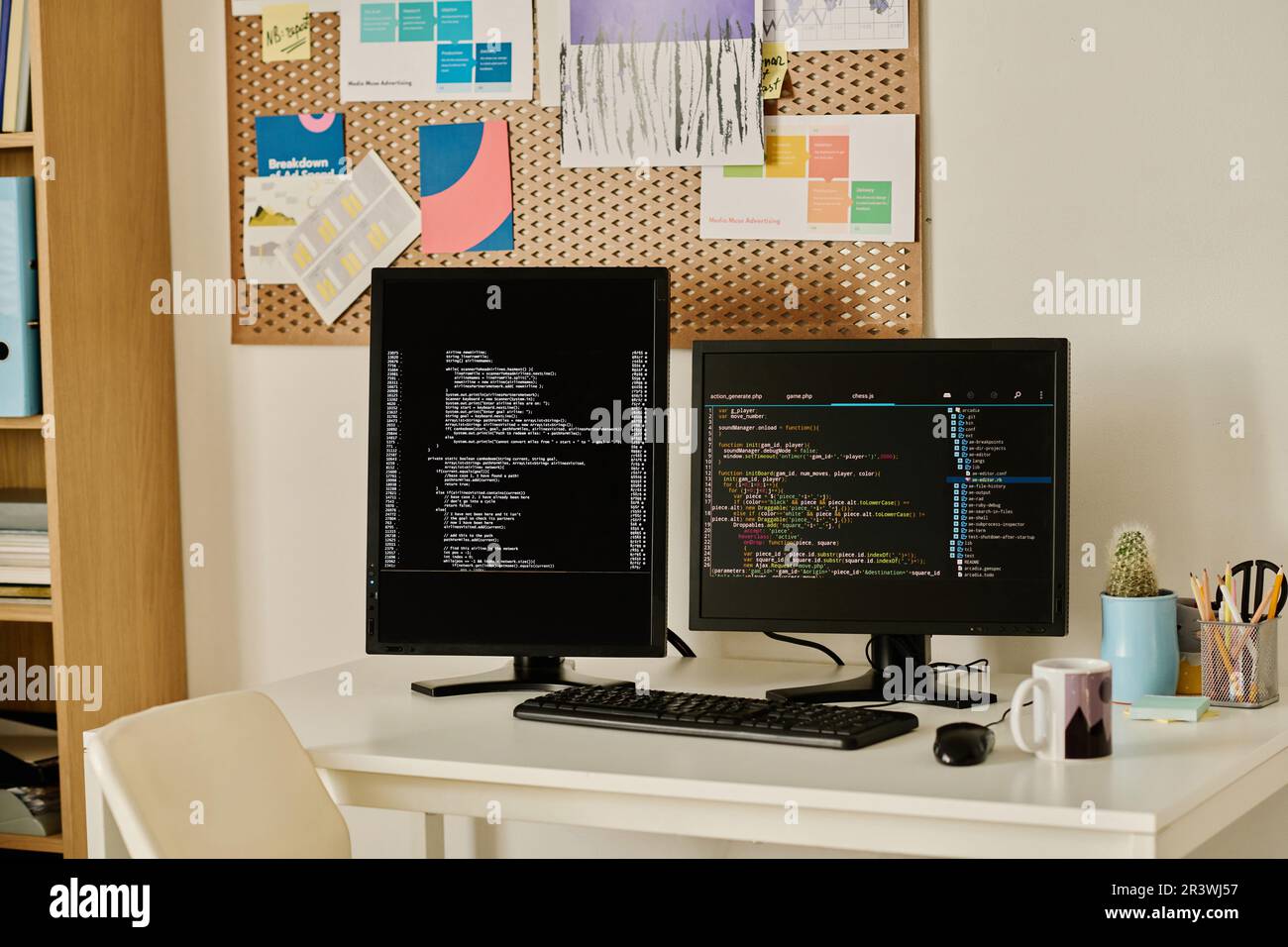 Close-up of computer with program codes on screen standing on table of ...