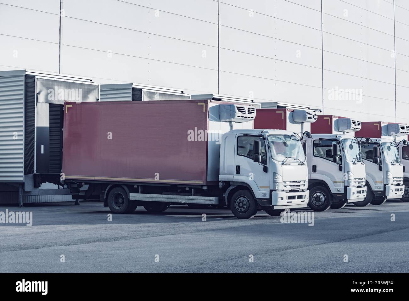 Freight trucks stand by the doors of the storage Stock Photo - Alamy