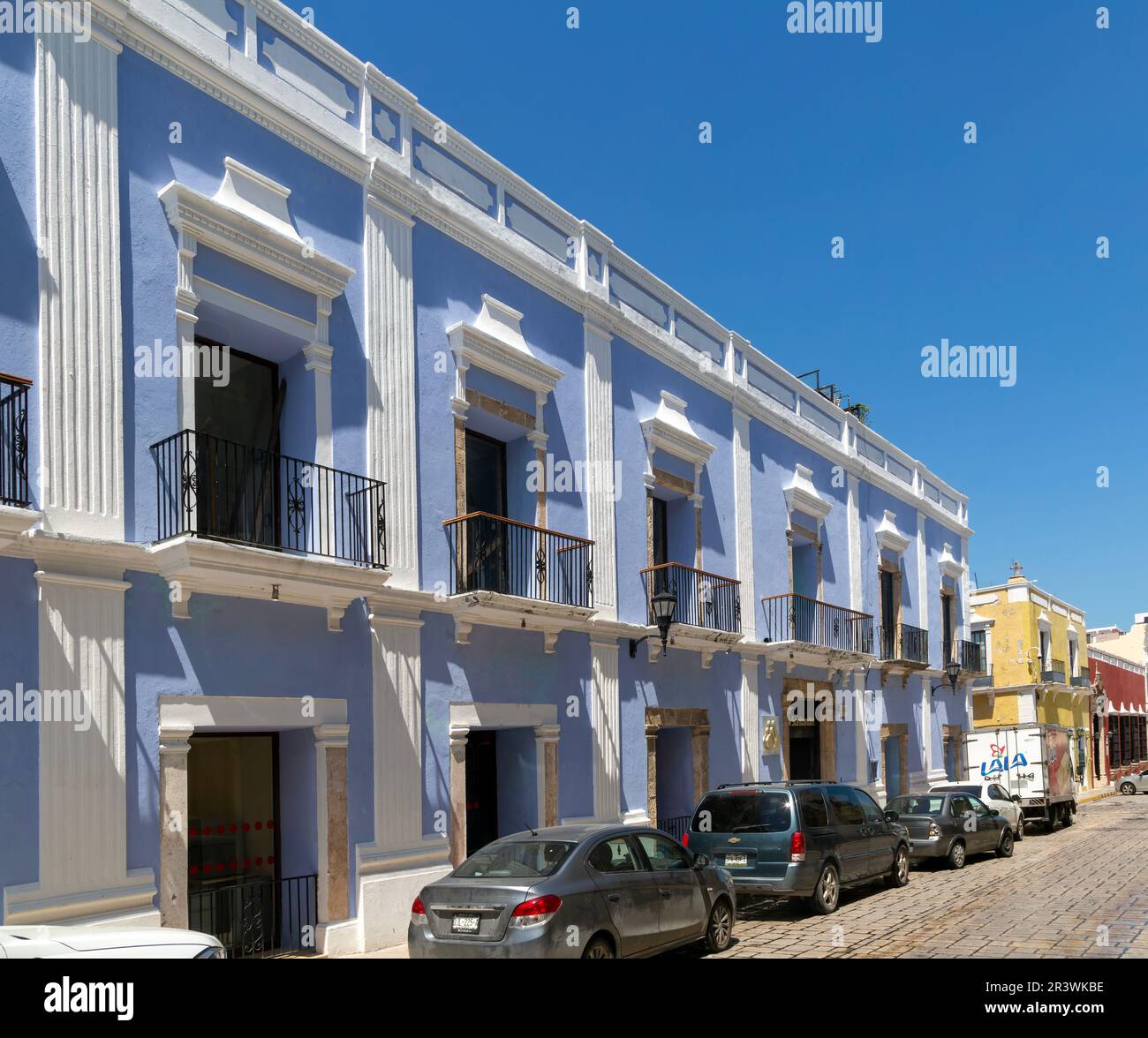 Spanish colonial buildings architecture cars parked on street, Campeche ...