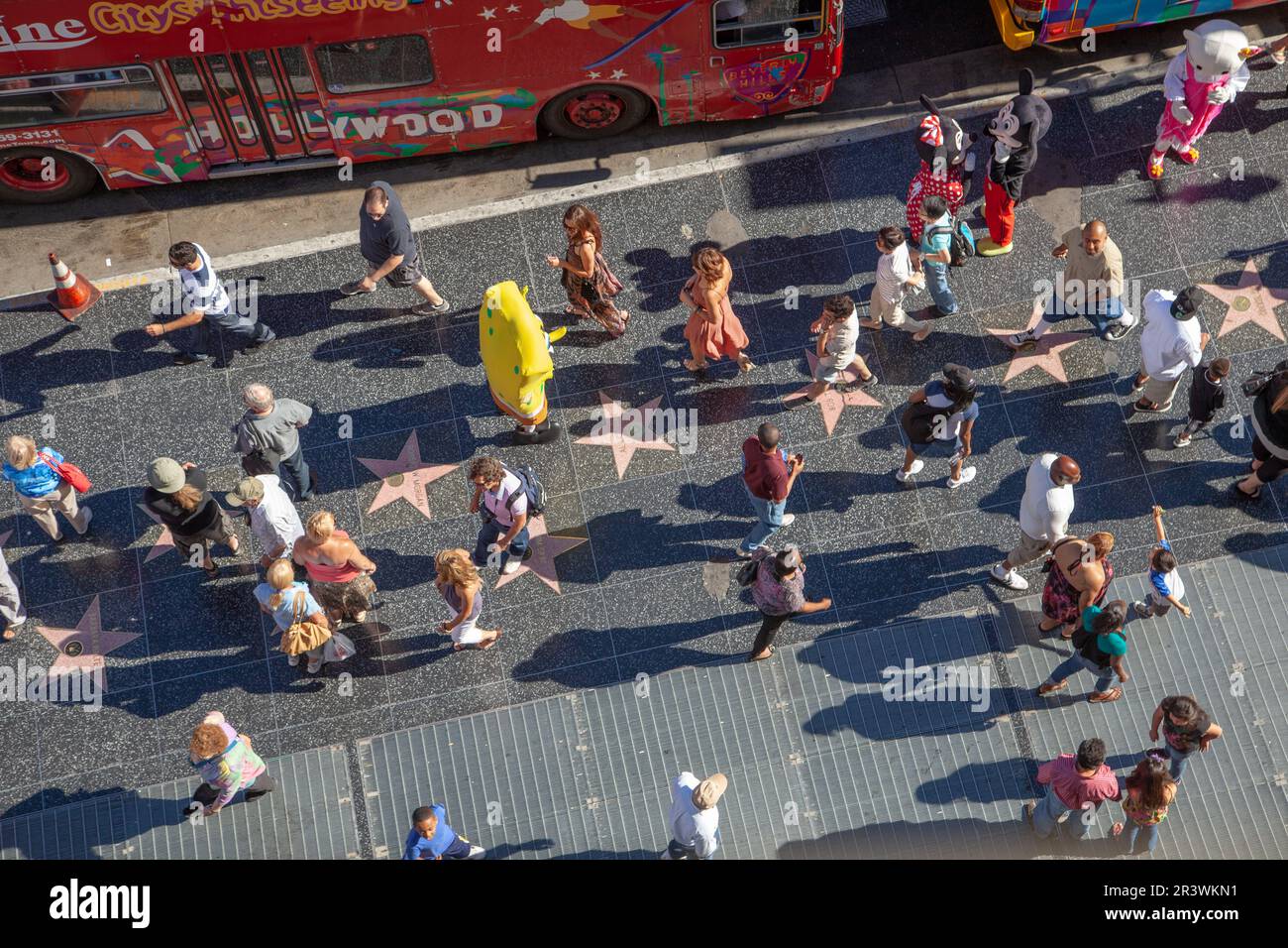 Los Angeles, USA - June 24, 2012: tourists enjoy walking at the walk of ...