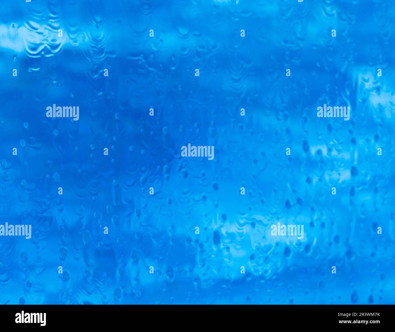 The blue of the sea with water drops on the pane Stock Photo - Alamy