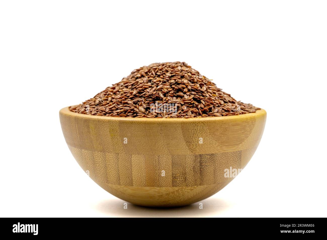 Linseed isolated on white background. Linseed or flax seed in wooden bowl Stock Photo - Alamy