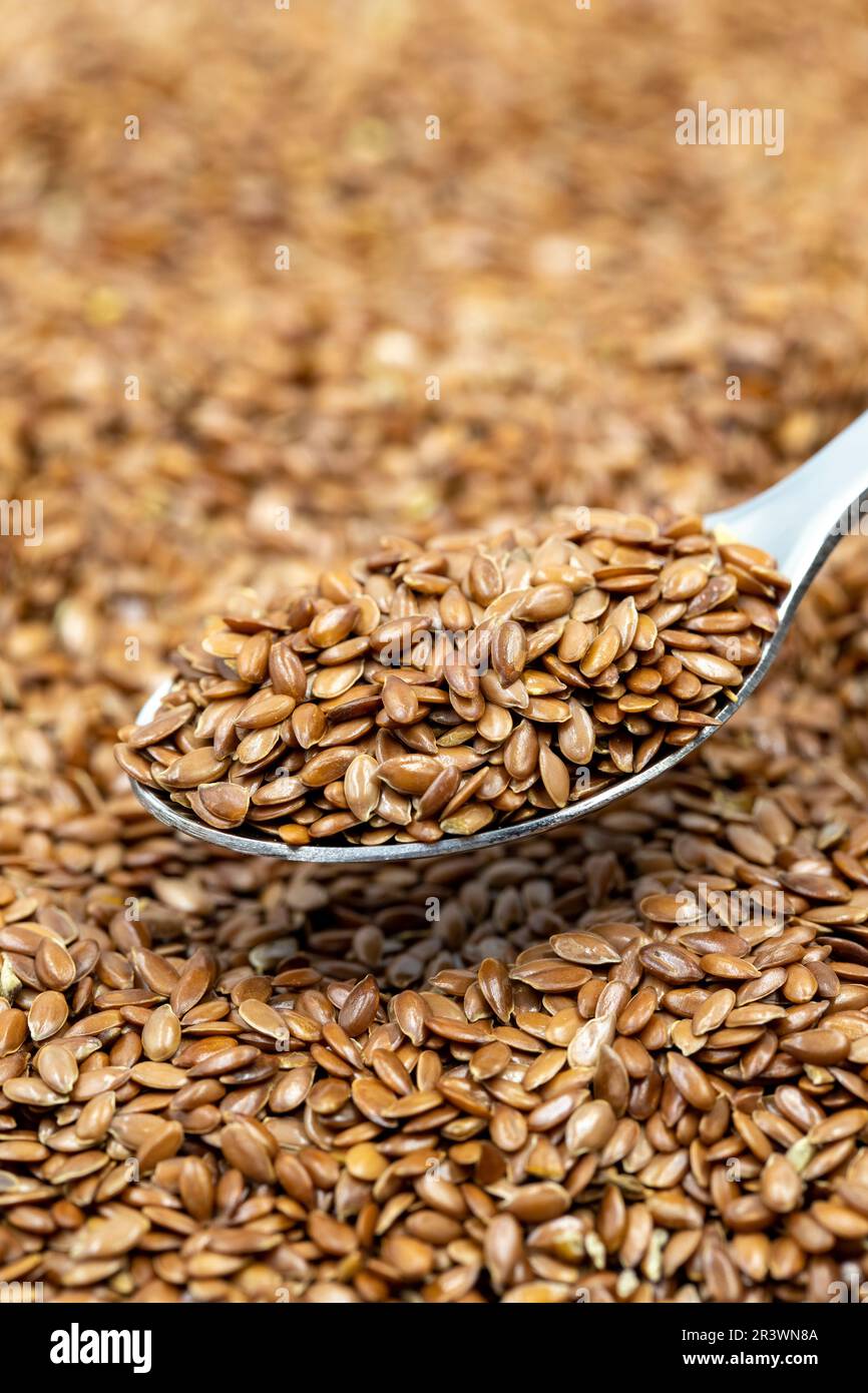 Flax seeds background or texture. Flaxseed or linseed in a spoon. cereals healthy food Stock ...