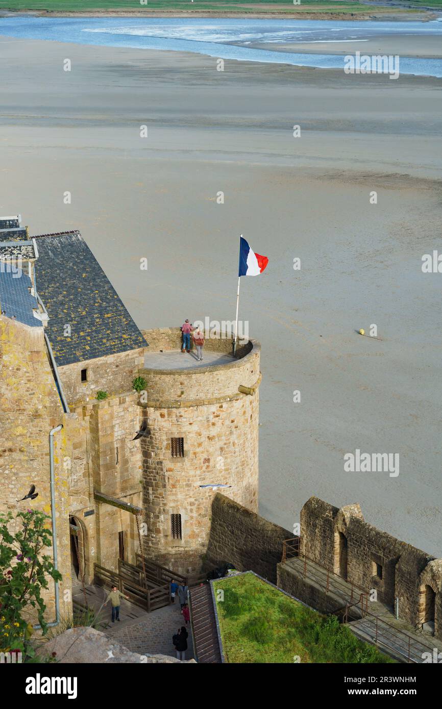 French flag flying from turret on St Mont Michel.. Portrait orientation ...