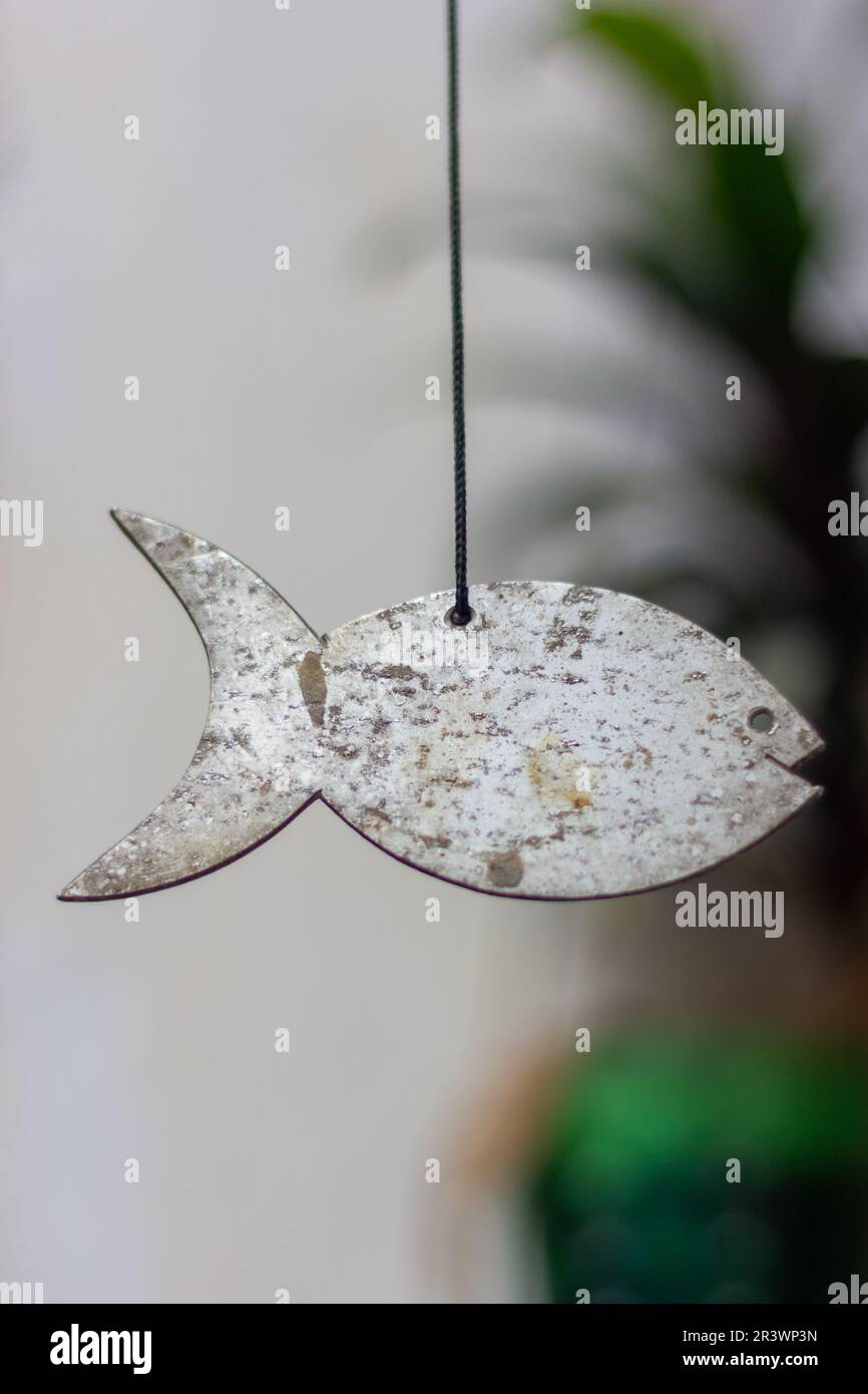 fish-shaped wind chime hanging by a thread Stock Photo - Alamy