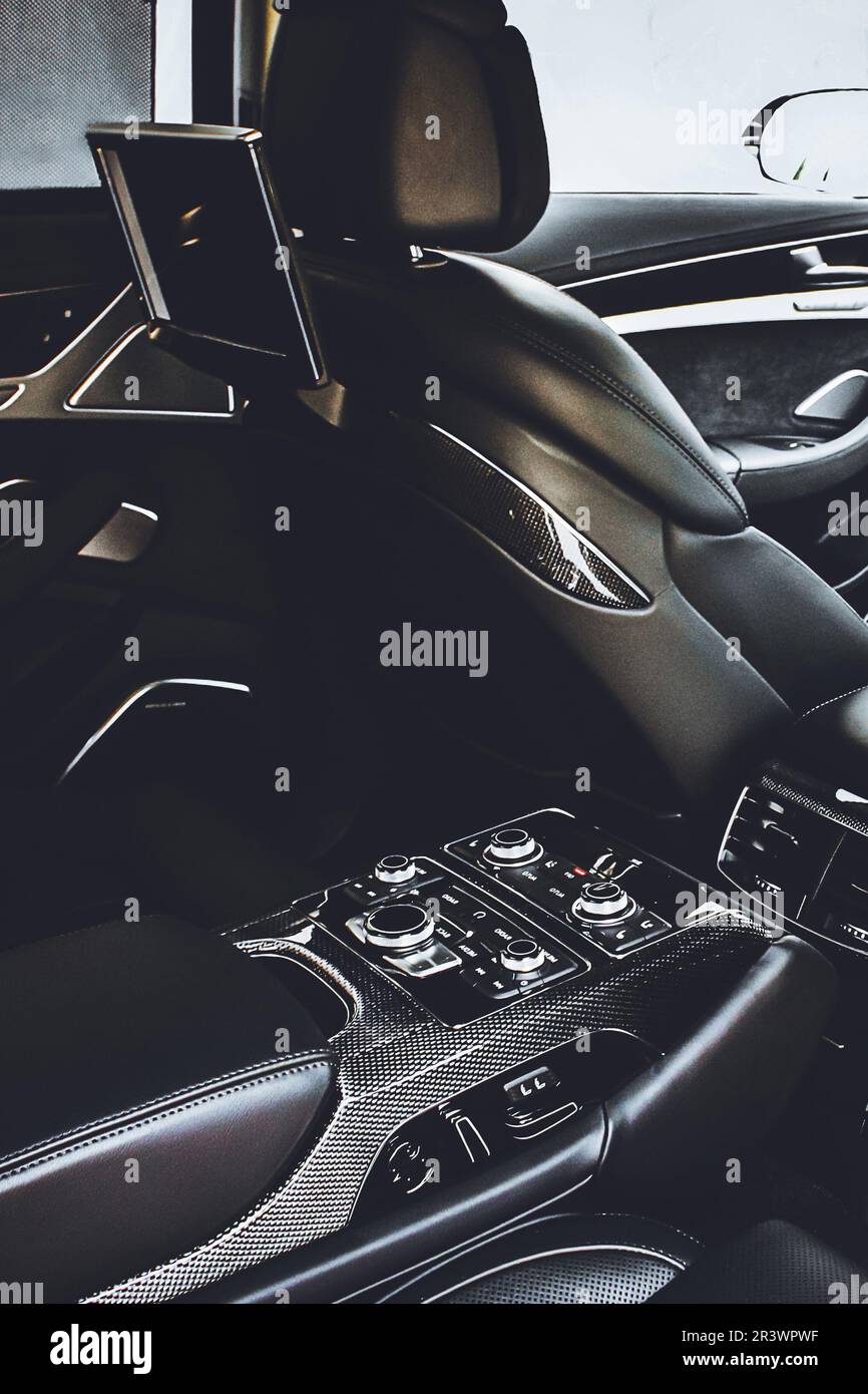 Dark luxury car Interior. Tuning. Carbon. Interior detail Stock Photo ...