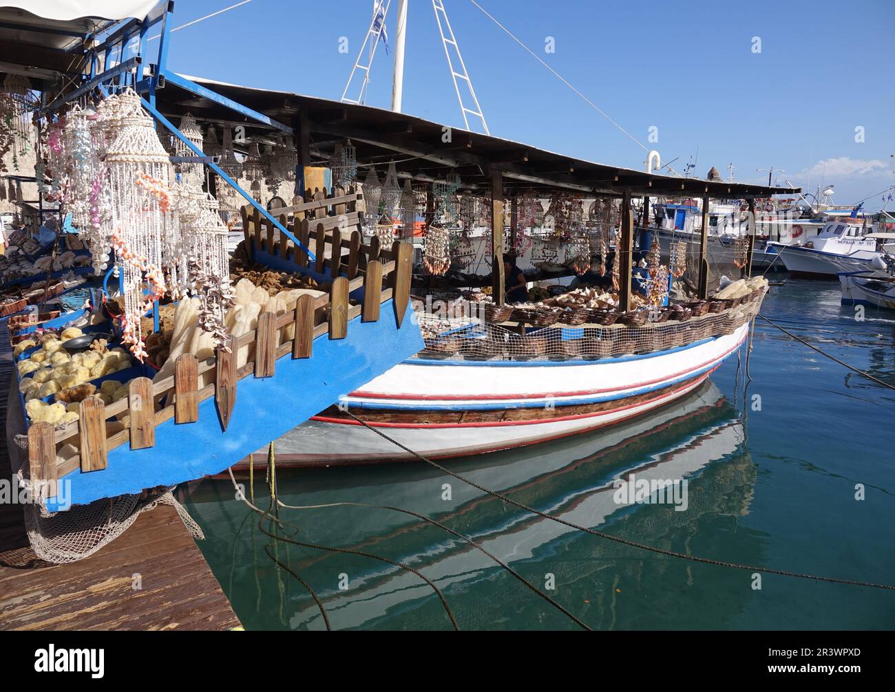 Boat with stall in Rhodes town Stock Photo - Alamy