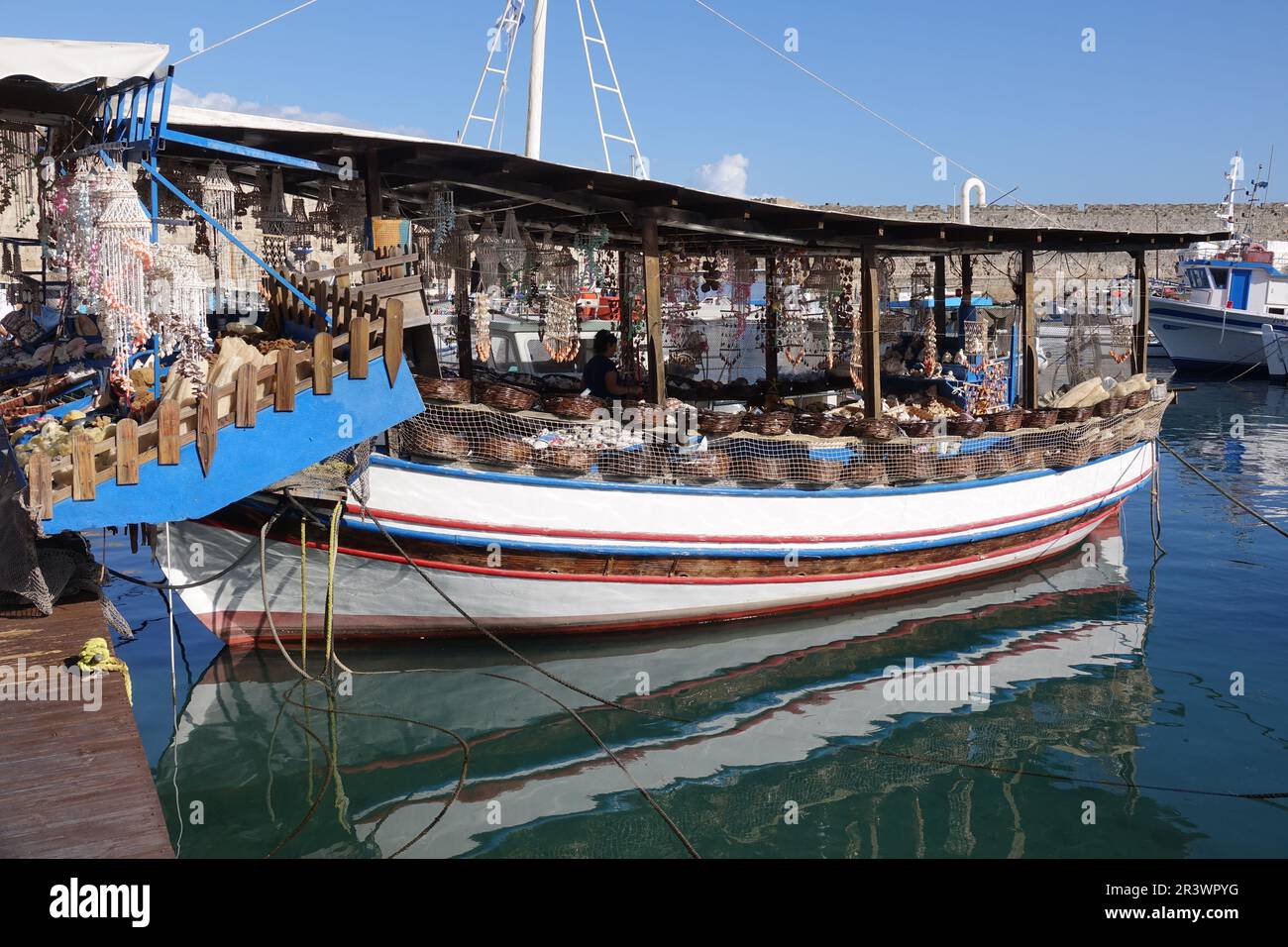 Boat with stall in Rhodes town Stock Photo - Alamy