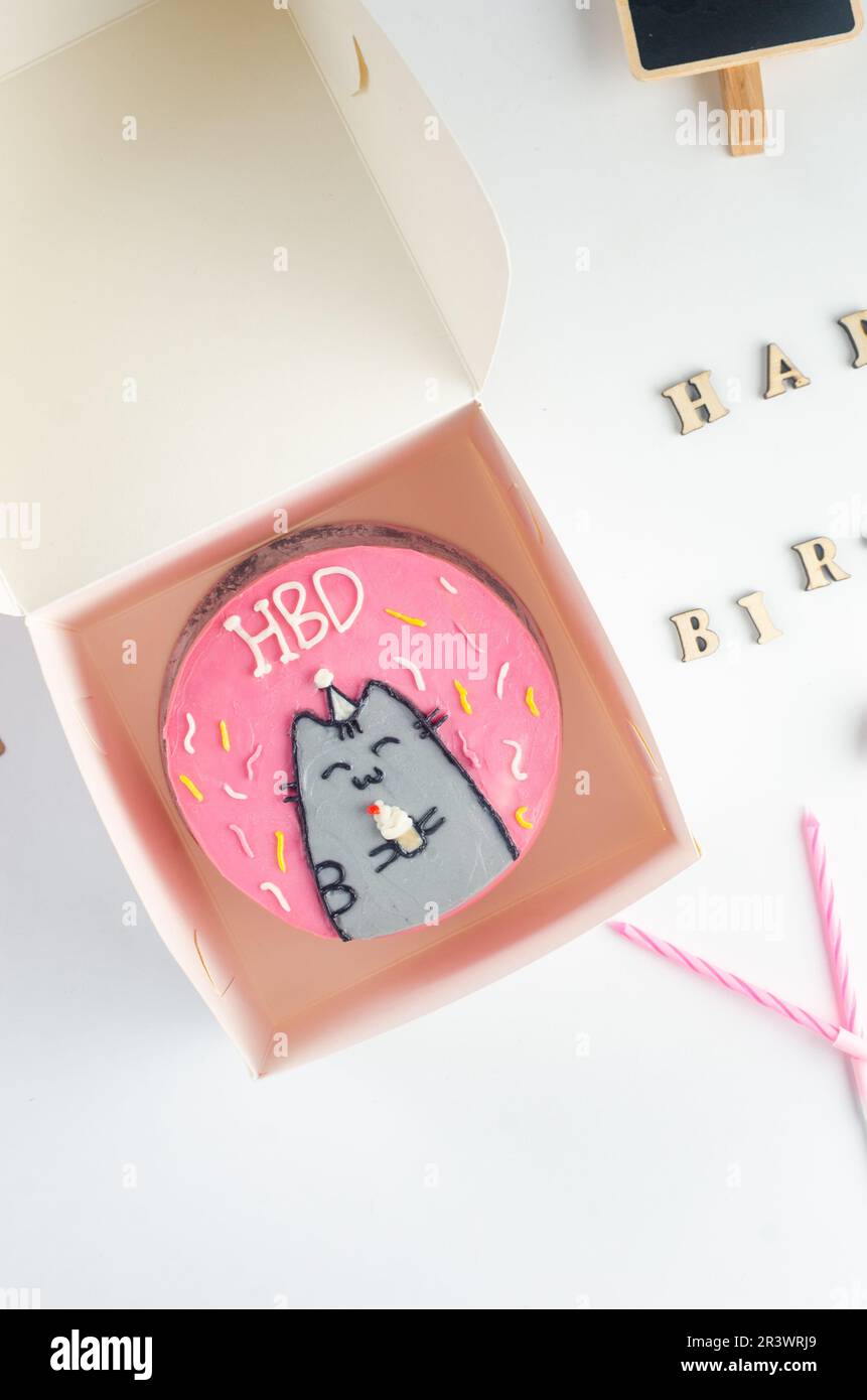 Trendy bento cake pink color with cute decor on light background. Cake ...