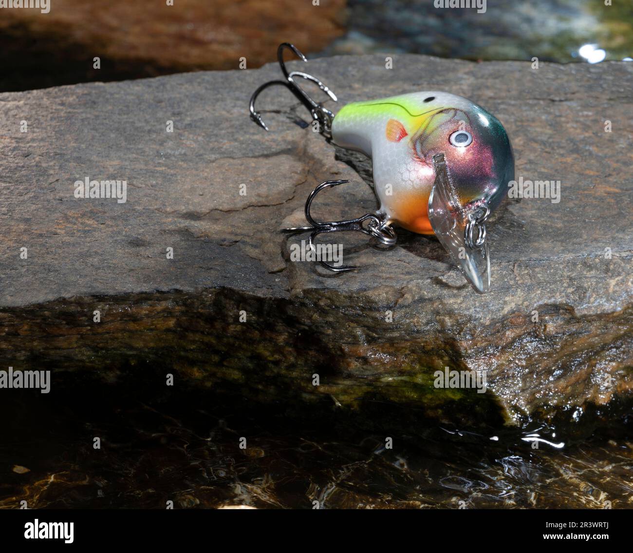 Water that is all around a lure on a rock Stock Photo - Alamy