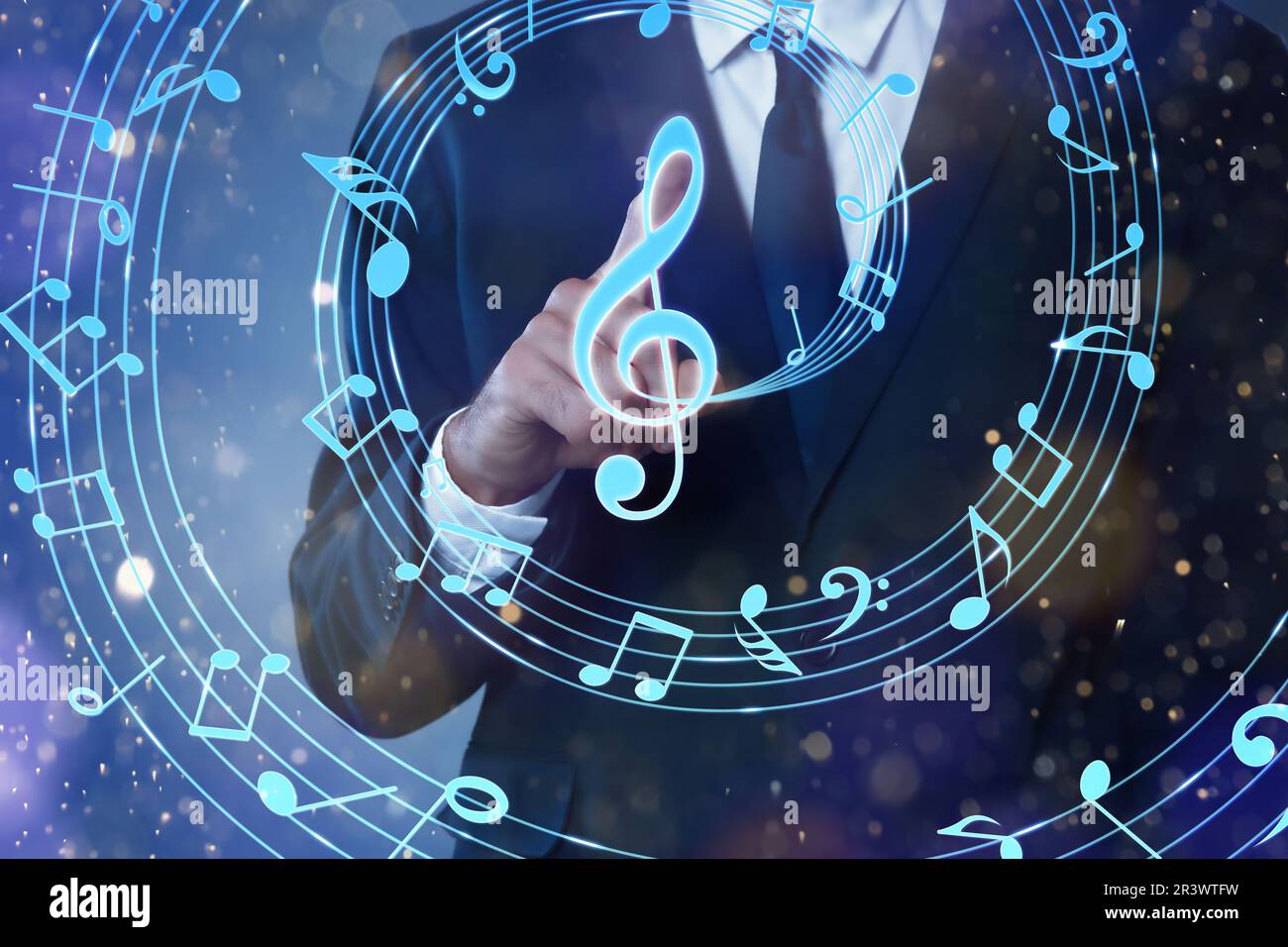 Musician pointing at staff with music notes and symbols on color ...