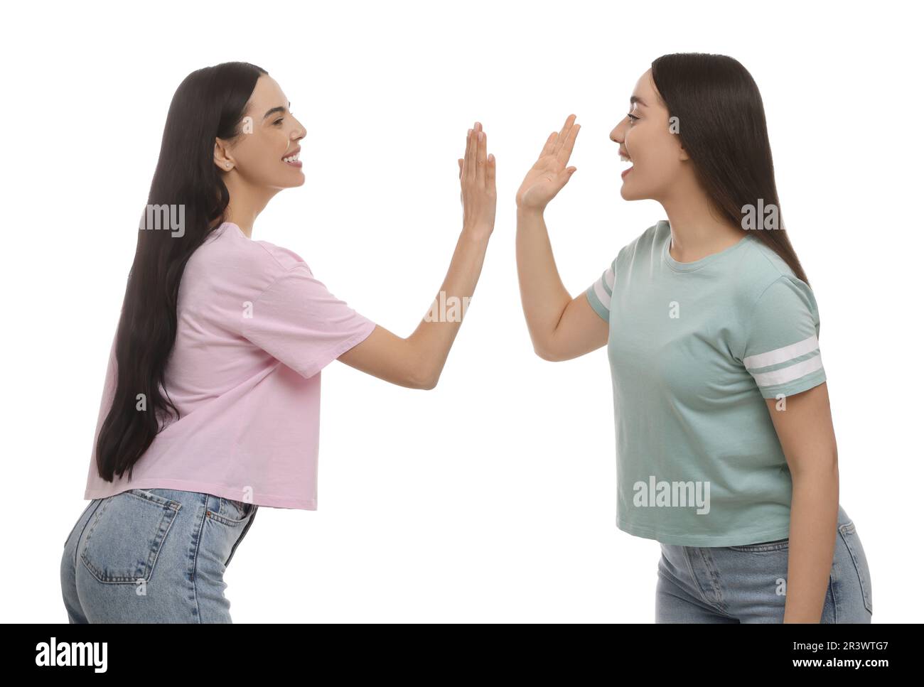 Women giving high five on white background Stock Photo - Alamy
