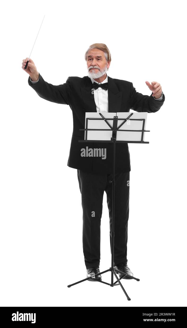 Professional conductor with baton and note stand on white background ...