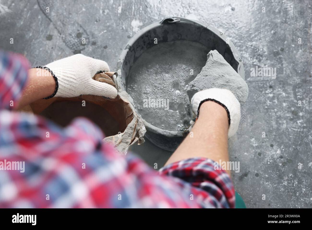 Male worker putting cement in hi-res stock photography and images - Alamy