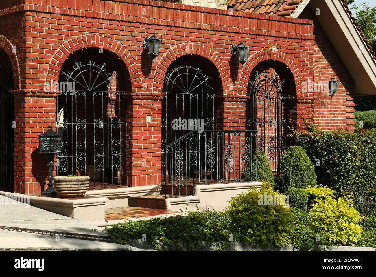 Entrance of building with beautiful old gates Stock Photo - Alamy