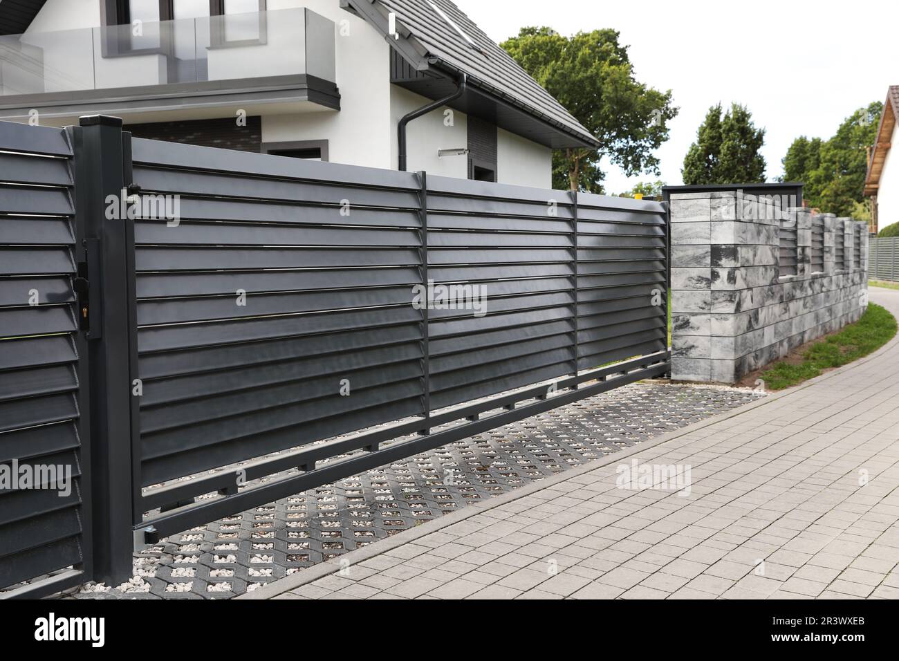 Metal gates near marble columns and house outdoors Stock Photo - Alamy