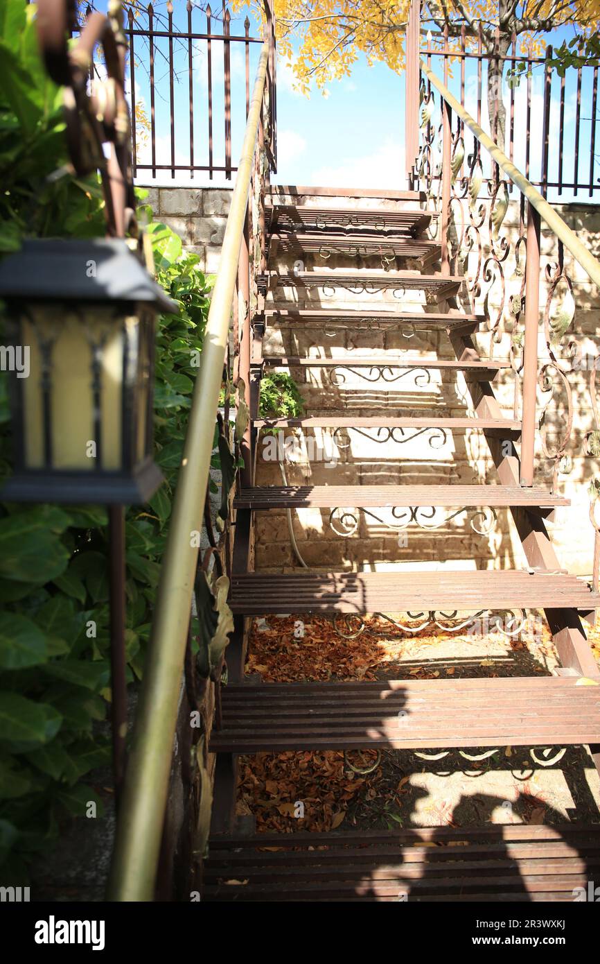 View of old metal stairs with handrails near brick wall outdoors Stock ...