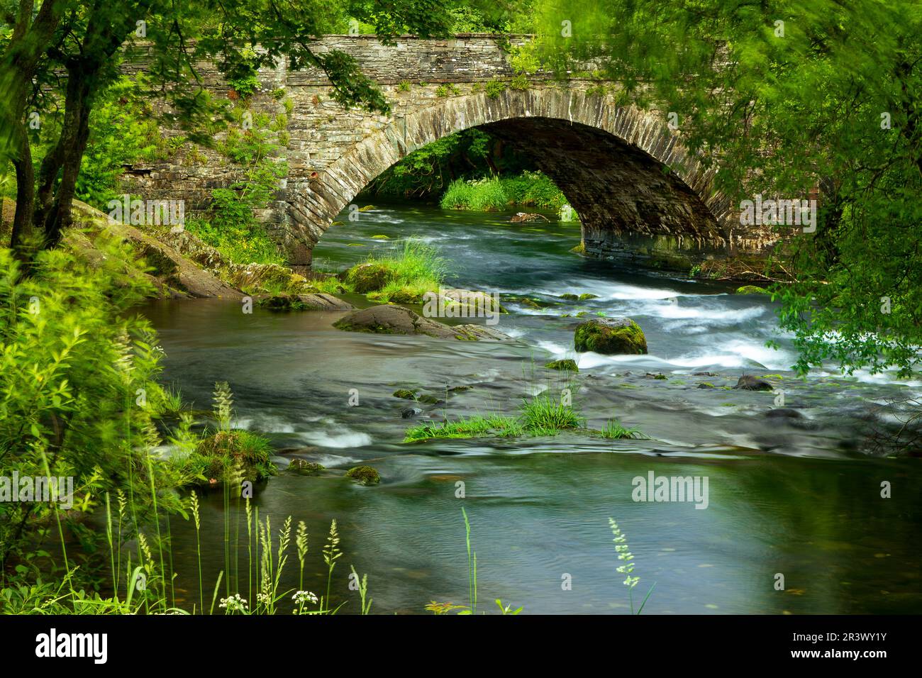 The River Brathay flowing under Skelwith Bridge Stock Photo - Alamy