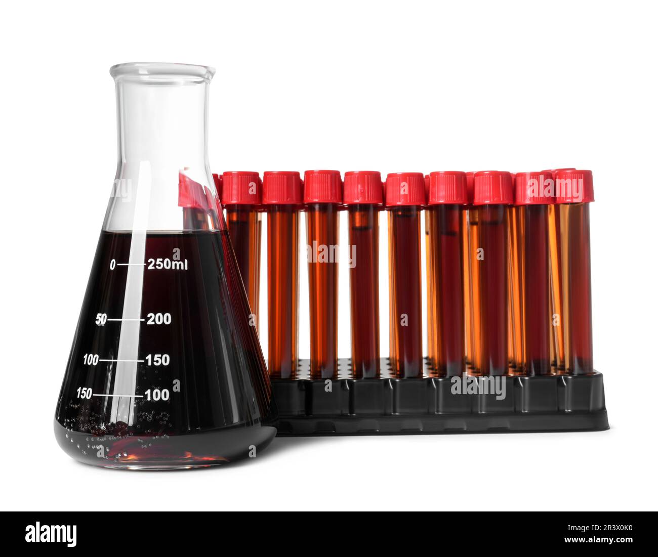 Different laboratory glassware with brown liquids on white background ...