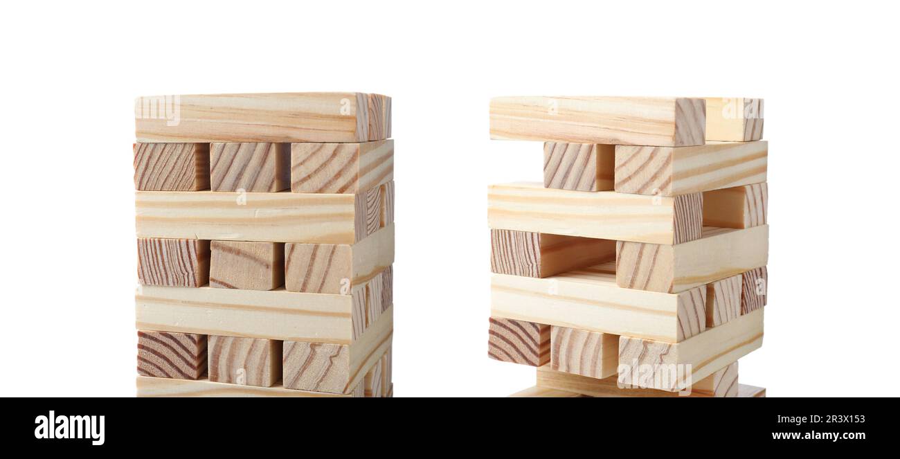 Jenga towers of wooden blocks on white background Stock Photo - Alamy