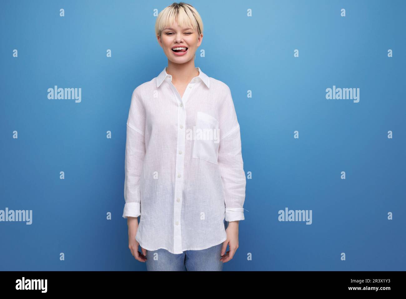 pretty fashionable woman with bob haircut dressed in white shirt ...