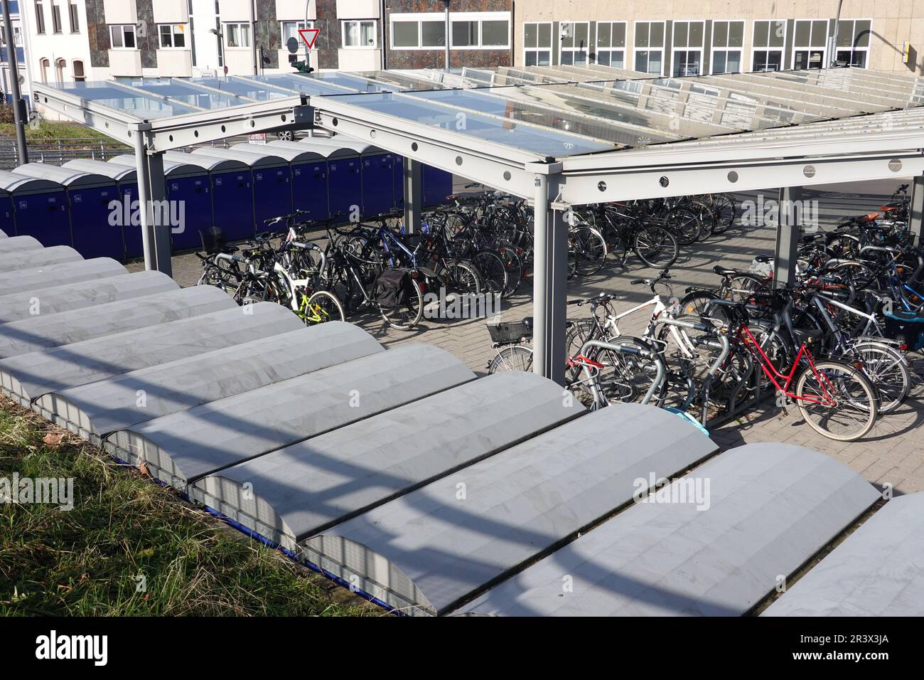 Covered bicycle parking with bicycle garages at the station Stock Photo ...