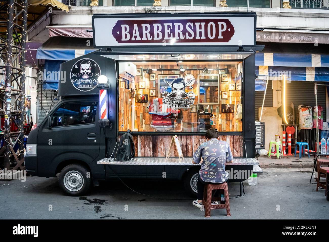 A mobile barber shop set up in Soi 1 Patpong Bangkok Thailand Stock ...