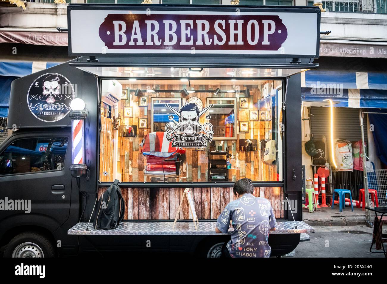A mobile barber shop set up in Soi 1 Patpong Bangkok Thailand Stock ...