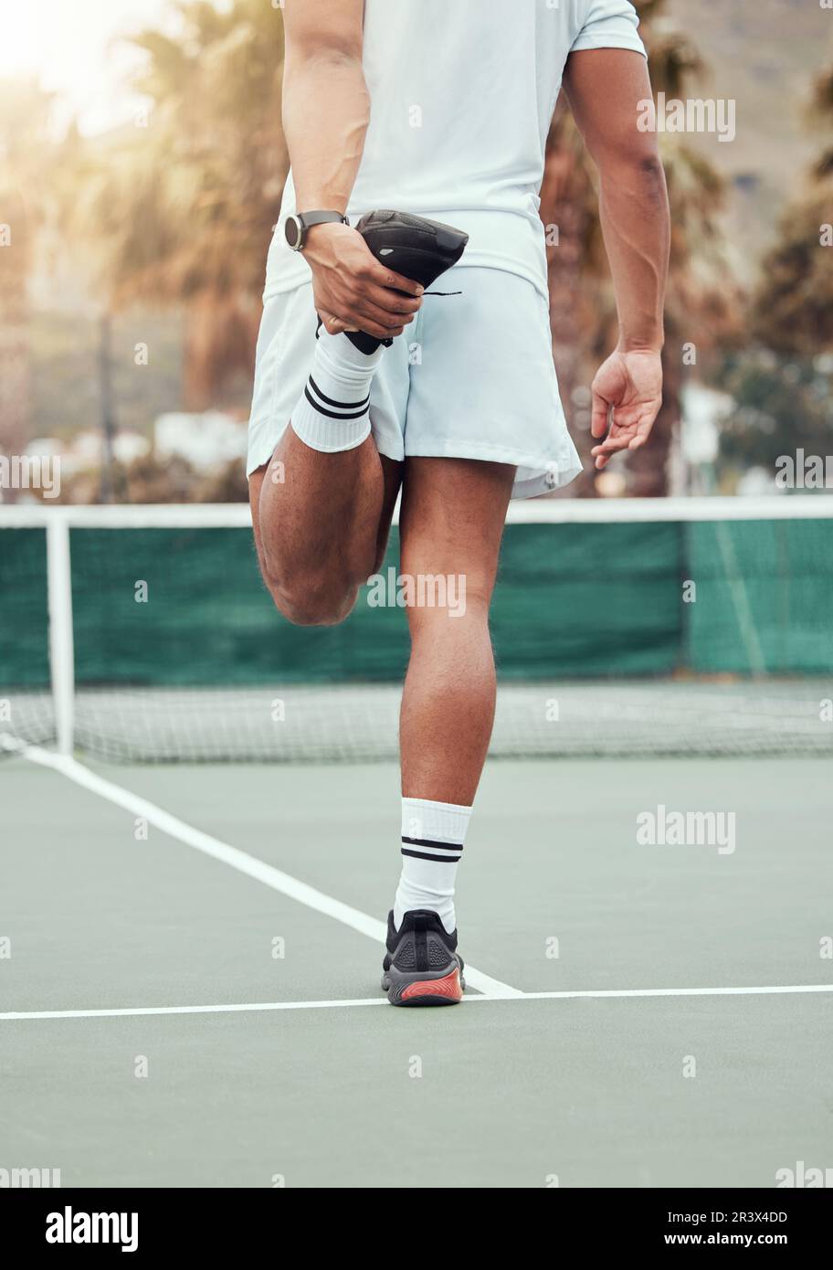 Man, hands and stretching legs on tennis court getting ready for match or game in the outdoors ...